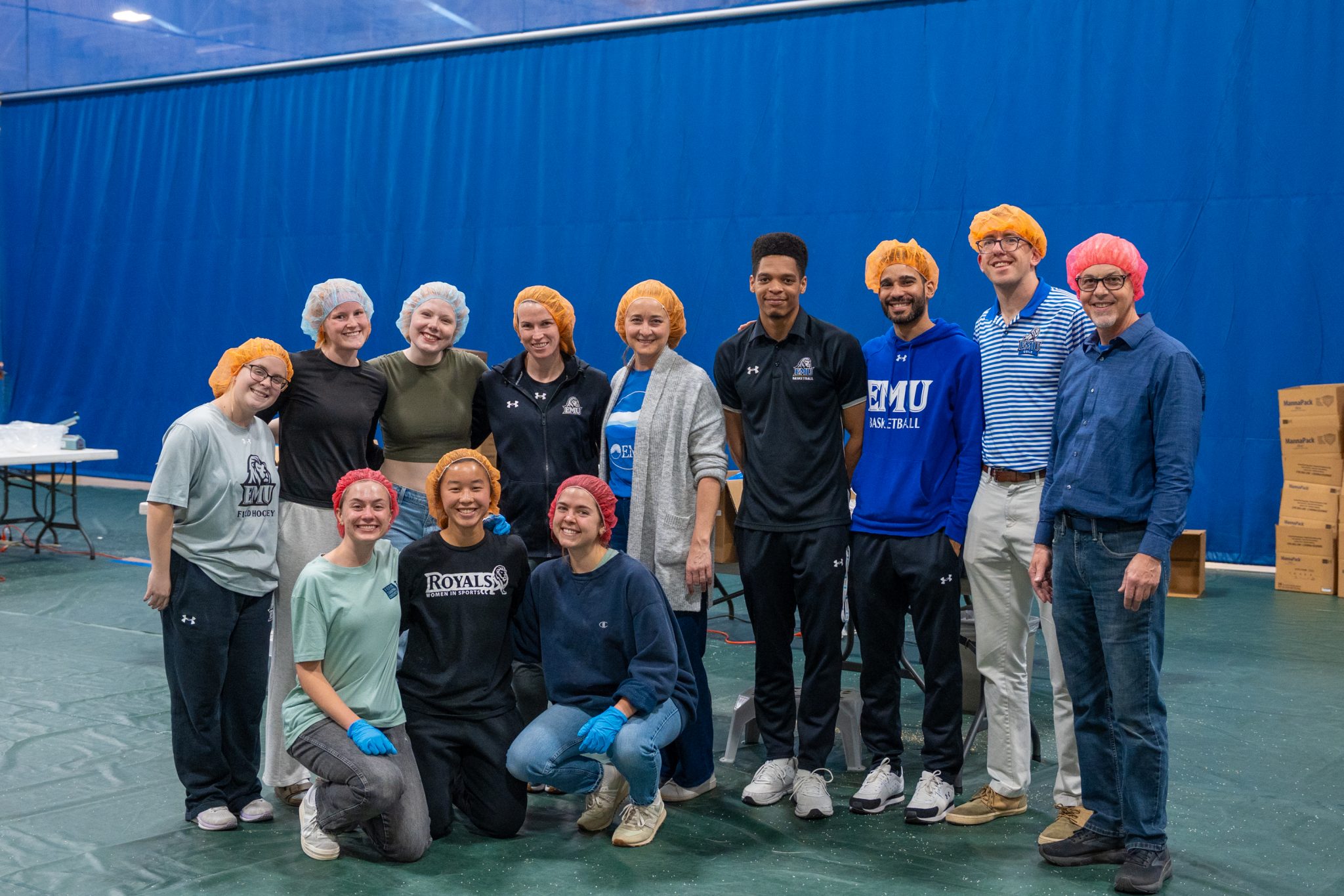 Volunteers pack 113K meals at EMU for hungry children around the world ...